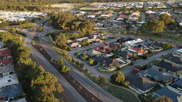 Daytime Timelapse of cars driving on a road through roundabout in Perth ...