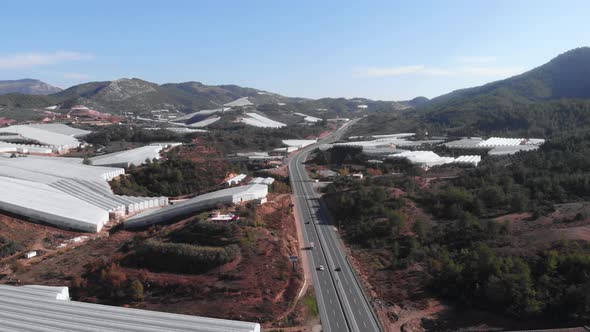 Big industrial plantation with greenhouses near highway. Agriculture ...
