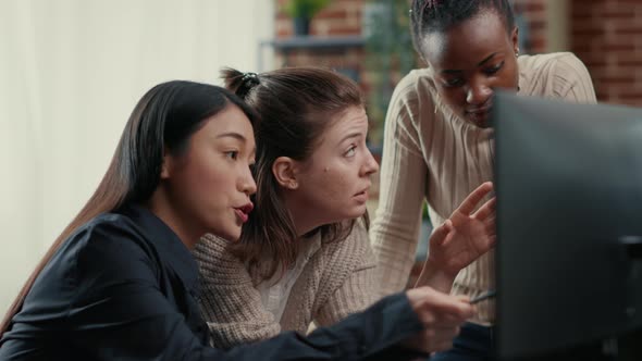 Software Engineer Pointing at Computer Screen Explaining Running Code to Coworkers Brainstorming ...