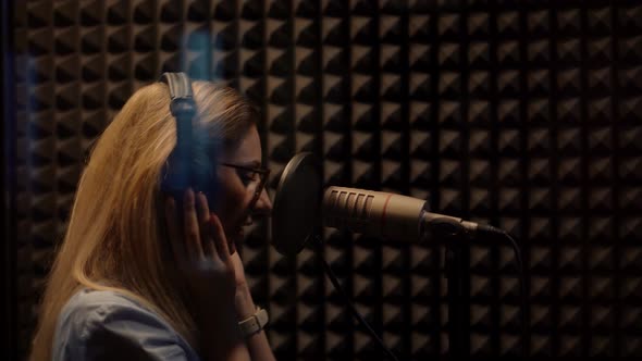 Girl In Headphones Singing On Radio Station. Music Production Vocal ...