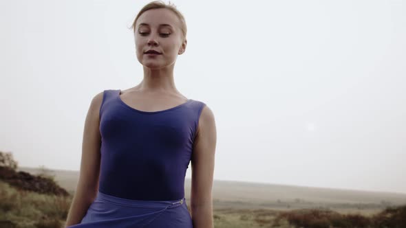 Woman in Sports Uniform Dances Outdoors Performing Movements From ...