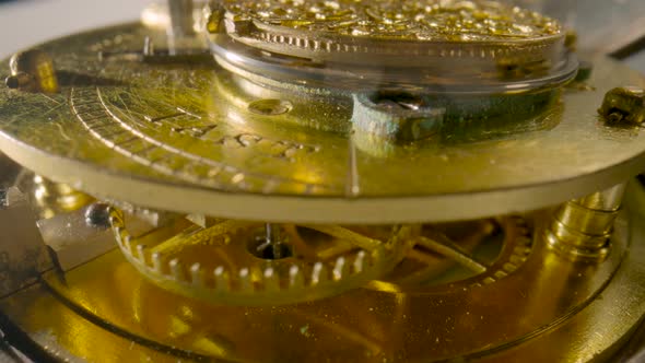 Inside View of Moving Clockwork of Golden Mechanical Clock, Stock Footage