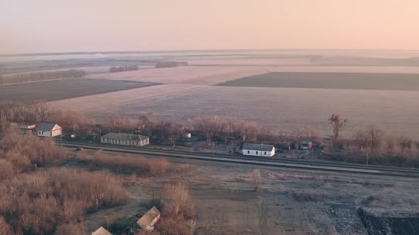 Small Empty Railway Station with Rails and Small Buildings Establishing ...