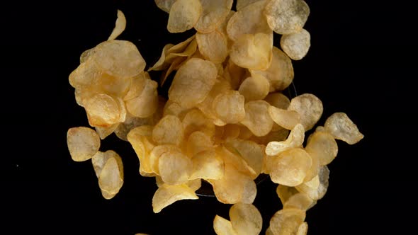 Super Slow Motion Shot of Rotating Exploded Salted Potato Chips on ...