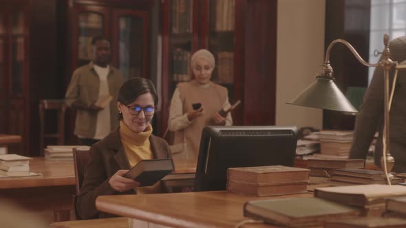 People Returning Books to Library, Stock Footage | VideoHive