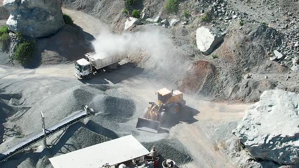 Aerial view of Extracting and transportation of rocks in a shale quarry ...