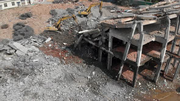 Aerial Overhead Moving Forward View of a Demolition Site with Two ...