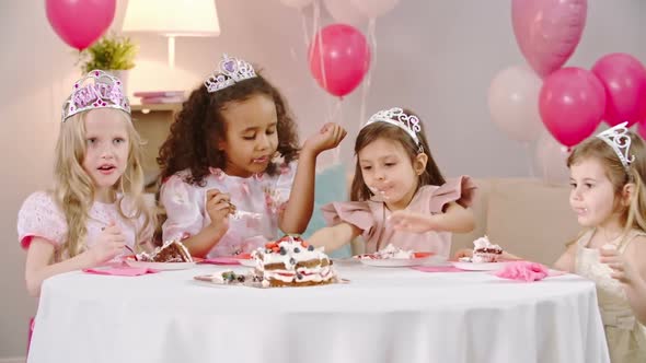 Sweet Princesses Eating Birthday Cake by Pressmaster | VideoHive
