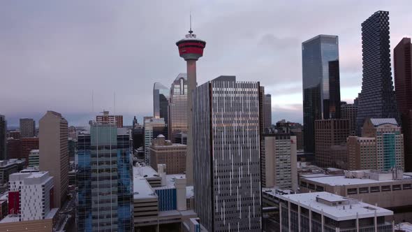 City downtown Calgary skyscrapers space needle winter snow trucking ...