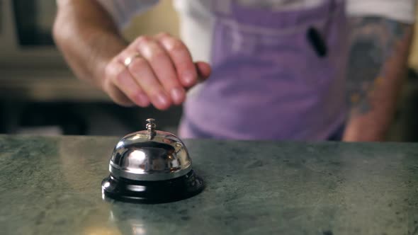 Close Up Macro Hand Chef and Ringing Bell Service on the Wooden in ...