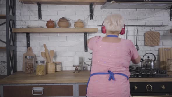 Back View Close-up of Positive Senior Caucasian Woman Dancing While ...