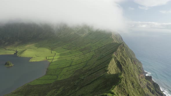 Aerial view of Caldeirao, a lake along the coastline on Corvo island ...
