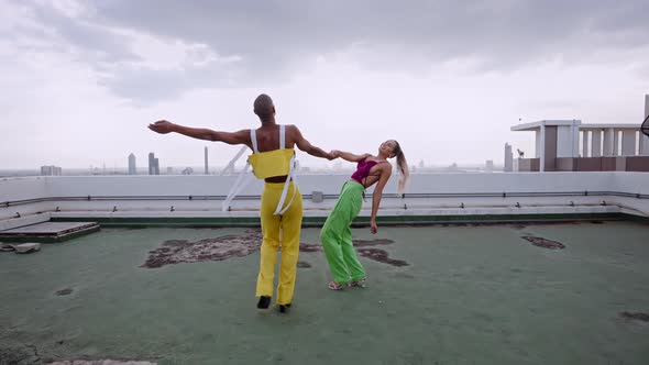 Models In Clubwear Dancing And Performing Together On Skyscraper, Stock ...