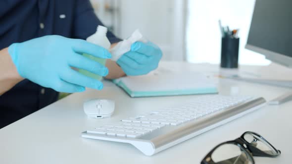 Close-up of Guy's Hands Wet Wiping Computer Keyboard at Work Using ...