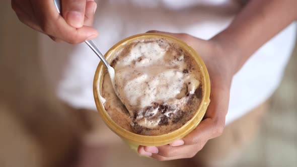 Young Men Eating Vanila Flavor Ice Cream in a Container, Stock Footage