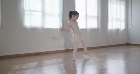 Little girl dancing alone in a studio, Stock Footage | VideoHive