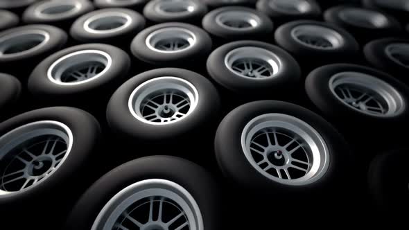 Endless animation of stacked one next to another F1 racing tires ...