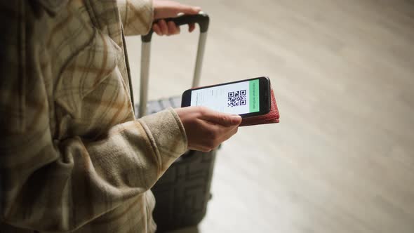 Tourist Showing QR Code on Phone in Airport Terminal, Stock Footage