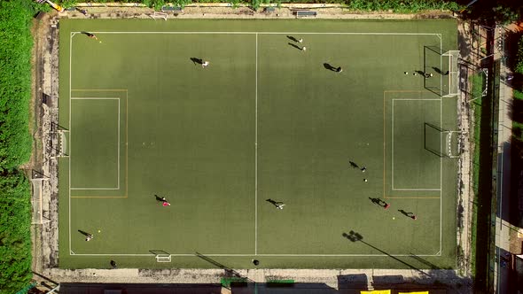 Aerial view of a football training in a football pitch on a summer day ...