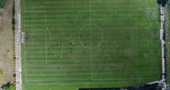 Two teams playing football top view. Children are playing football ...