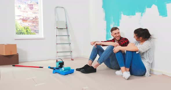 Cute Couple High Fiving After Painting in New Home Happy Home ...