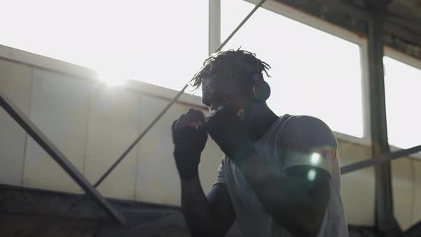 Male Boxer Practicing Shadow Boxing Indoors Sunlight Pouring From ...