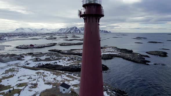 Beautiful aerial pedestal shot of the Andenes Lighthouse in Norway with ...