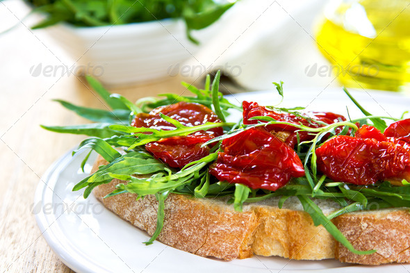 Sun dried Tomato with Rocket sandwich Stock Photo by vanillaechoes