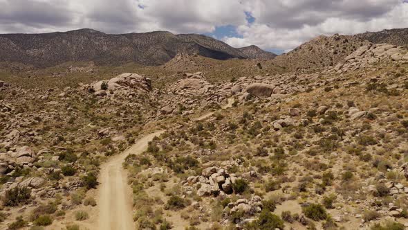 Aerial shot of interesting rock formations in the desert of California ...