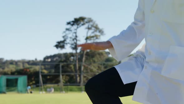 Cricket umpire signaling a leg bye during match, Stock Footage | VideoHive