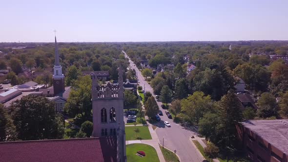Rotating aerial of old stone tower and campus area at Hope College, MI ...