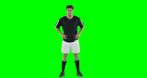 Confident Football Player Standing Against Green Screen, Stock Footage