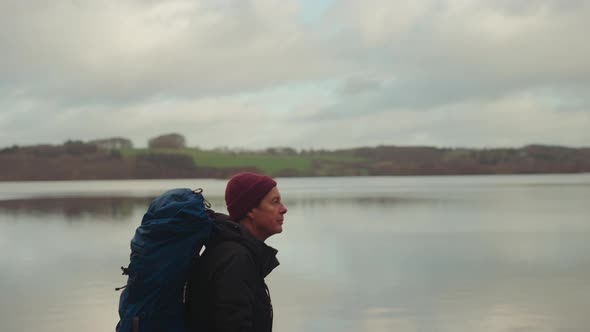Tourist with Huge Backpack Walks Along the Lake in Himmelbjerget Area ...