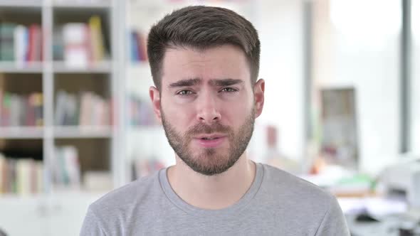 Portrait of Sad Young Man Looking at Camera, Stock Footage | VideoHive