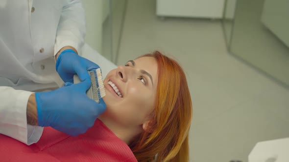 the Dentist Determines the Color of the Patient's Teeth Using a Tooth ...