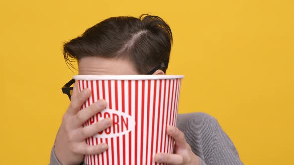 Boy Watching Horror Movie Hiding Behind Popcorn Bucket Yellow ...