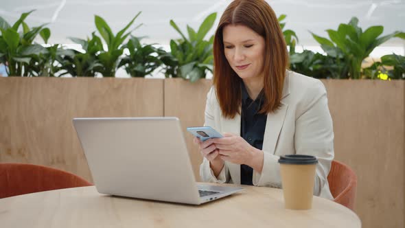 Businesswoman Smiling While Texting Message on Phone, Stock Footage