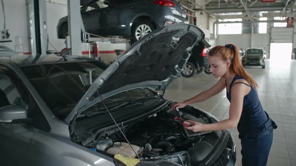 Lady Mechanic Working in Car Service, Stock Footage | VideoHive