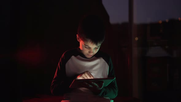 Child browsing tablet in evening by ADDICTIVE_STOCK | VideoHive