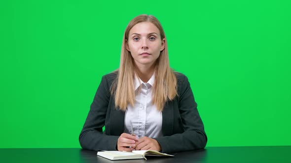Caucasian Female Interviewer is Sitting at a Table and Talking to an ...