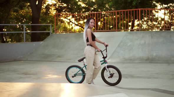 Attractive Stylish Girl with Dreadlocks Walks with Bmx Bike in ...
