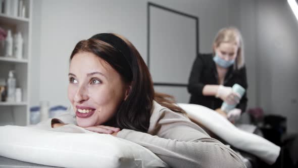 Waxing Procedure Depilation Master Applying the Wax on the Leg on Her ...