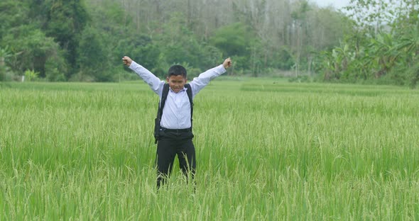 Asian Boy Student Celebrating In Rice Field, Stock Footage | VideoHive
