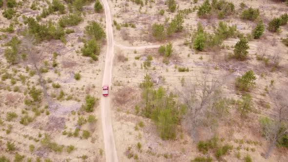 Off-Road Vehicle Travels Down The Rough Road In Leota, Michigan. aerial ...