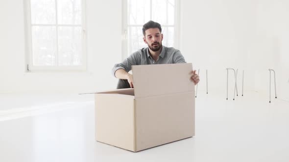 A man opening a box, Stock Footage | VideoHive