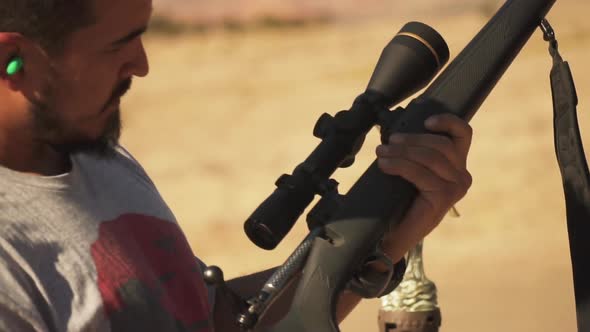 Close Up Of Inspecting Rifle And Loading The Weapon In Summer., Stock ...