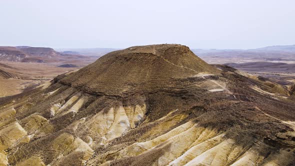 Aerial fly in over Mount Ramon and reveal of the Ramon Crater. This ...