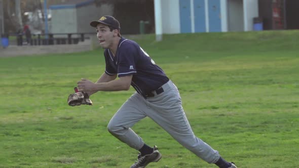 A young man playing catch with a baseball., Stock Footage | VideoHive