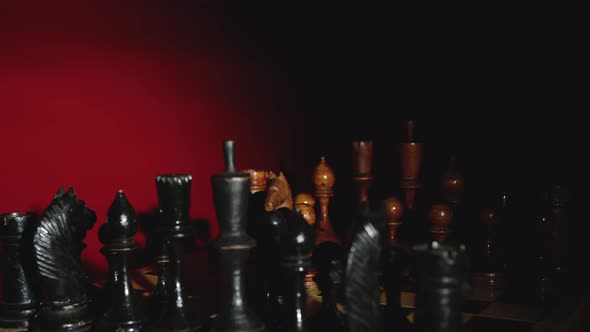 Wooden Chess Pieces on Chessboard Spinning on Red Background in ...