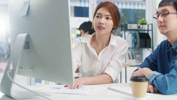 Asia business in small modern urban office. Japanese male boss ...